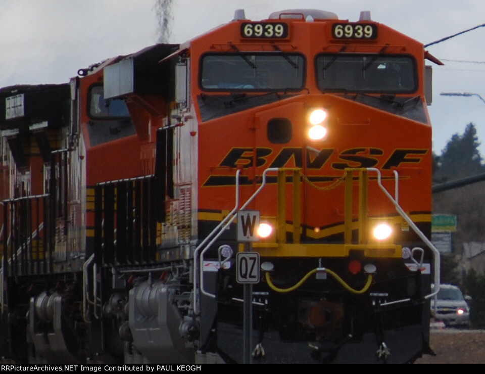 Zoom in Shot of the Cab of BNSF 6939 as she heads East Leading a Manifest Train towards Winslow, AZ.